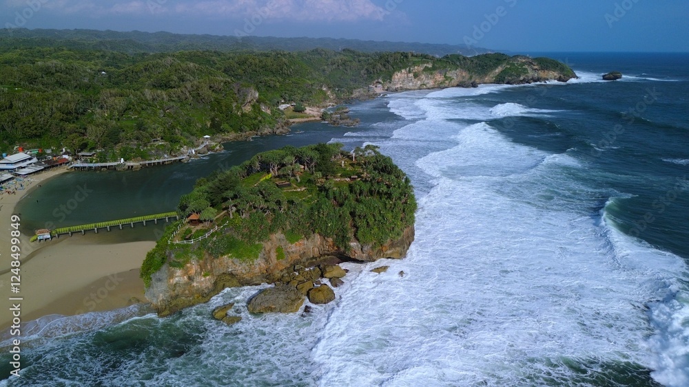 Aerial Drone view of the beach with white sand, coral rocks, hills with ...