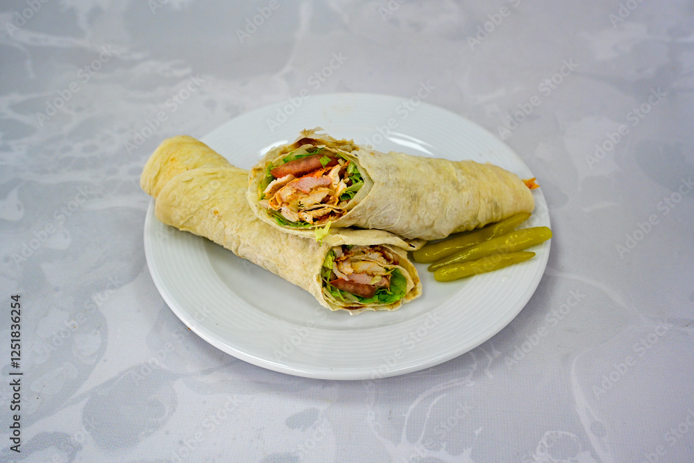 Lavash zurna doner kebab ( zurna durum ) or shawarma sliced in plate ...