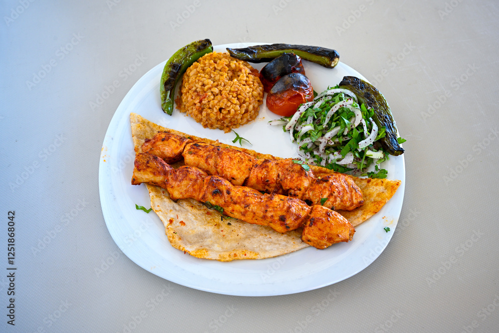 Chicken wings barbeque in a dish with BBQ grill sauce . Izgara tavuk ...