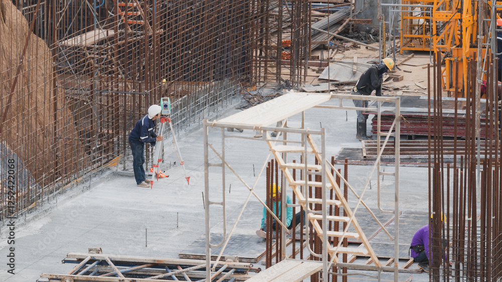 Construction Site Progress Precision, Teamwork, Workers collaborate on ...