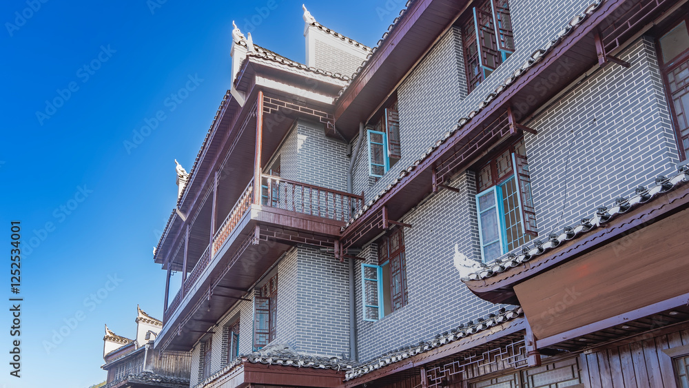 Chinese architecture. A fragment of a brick apartment building. Windows ...