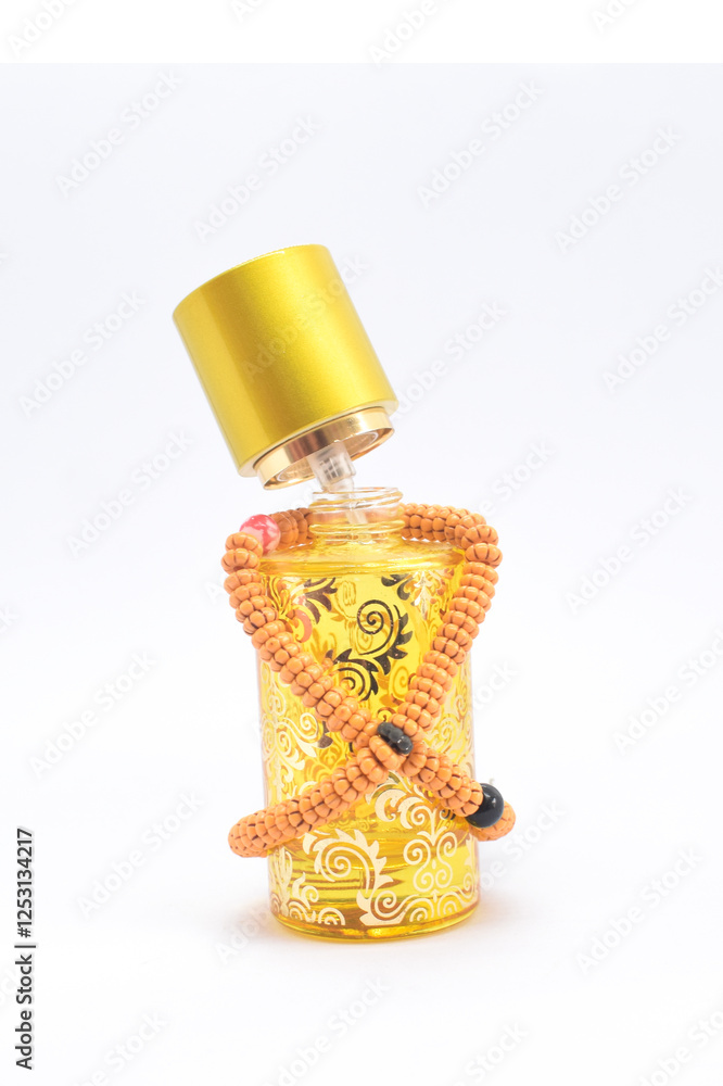 Antique glass bottle filled with indian fragrance oil (Attar). white ...
