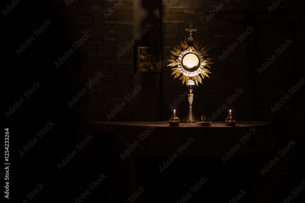 Stock-Foto „Adoration of the Blessed Sacrament at night in a community ...