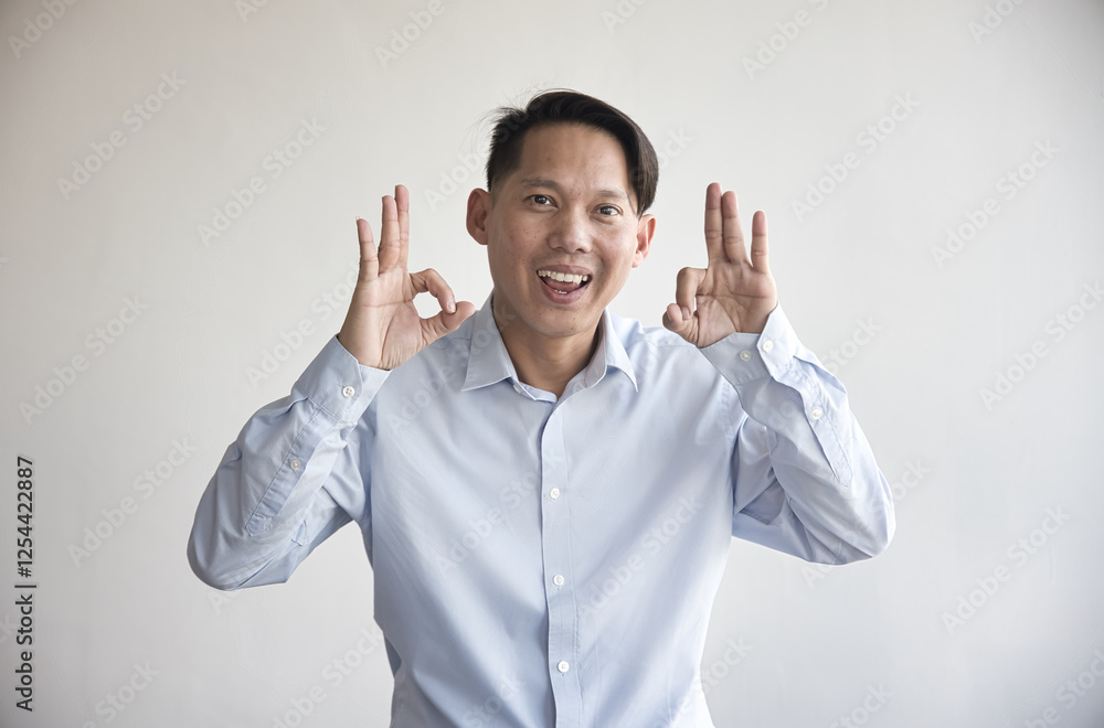 Happy smiling Asian middle aged old man showing approving, passing ...