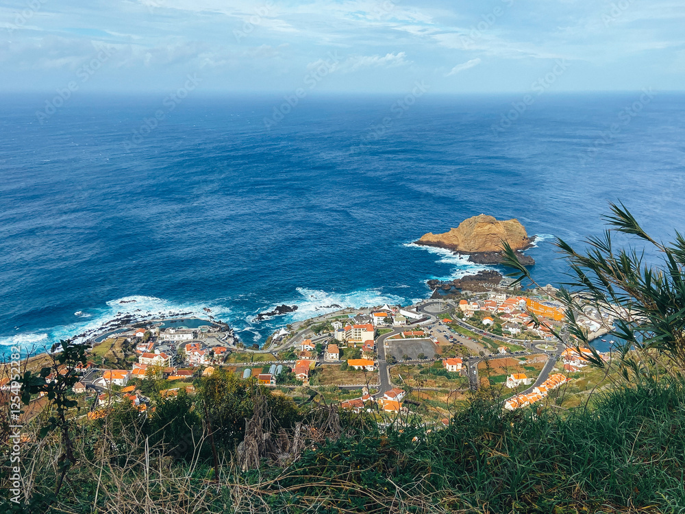 View from above of the city of Porto Moniz, Madeira: natural lava pools ...