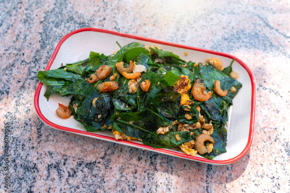 Stir-fried Malindjo Leaves with Egg and Dry Shrimp Local Thai food menu ...
