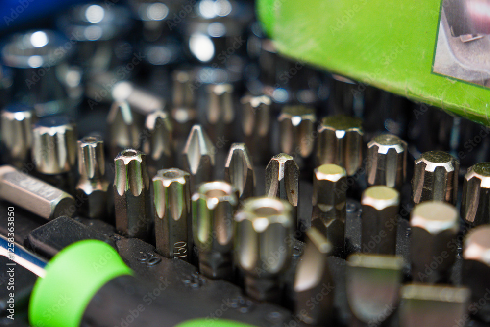 Different types of screwdriver bits in a suitcase. Tools for repairs ...
