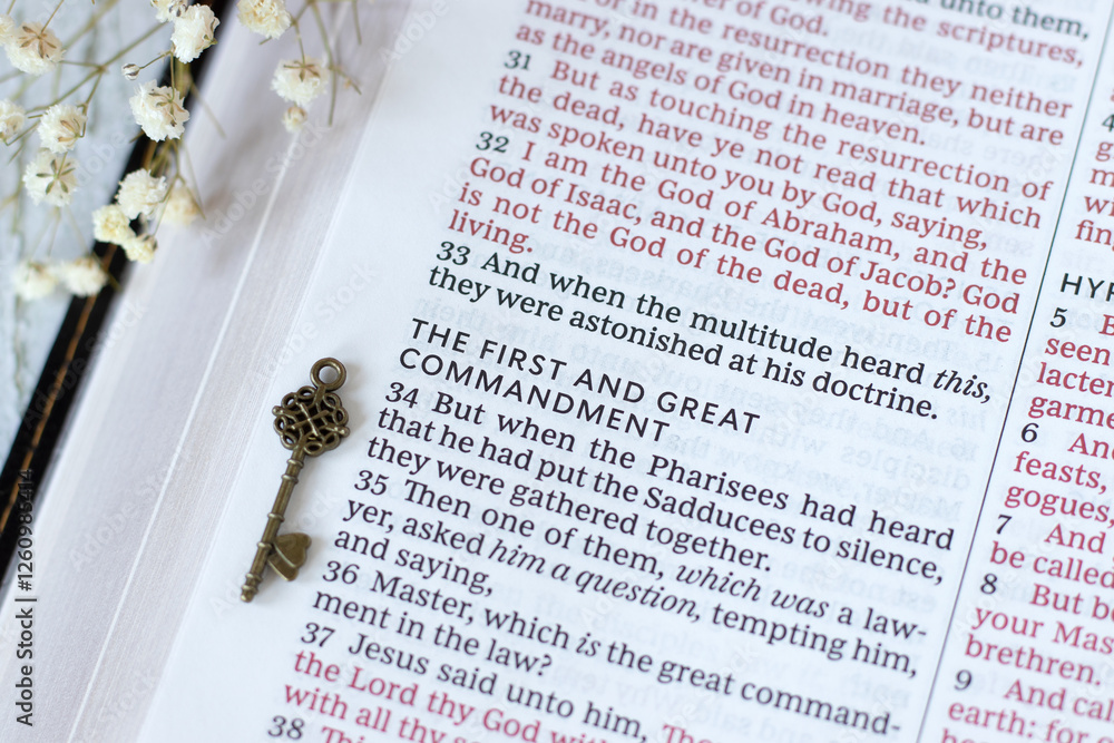 First and great commandment text in open holy bible book. Close-up ...
