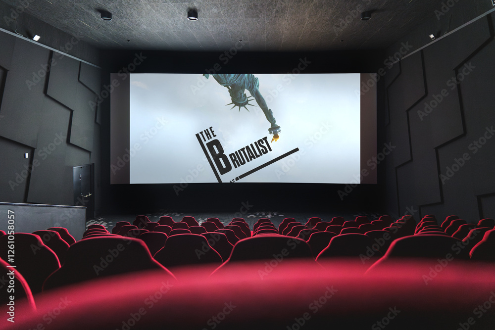 Movie theater interior with The Brutalist film poster on screen. Cinema, entertainment, film ...