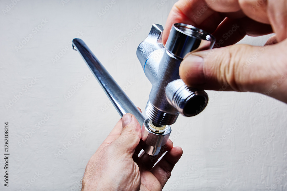 Installing bath mixer tap with long spout using threaded connection ...