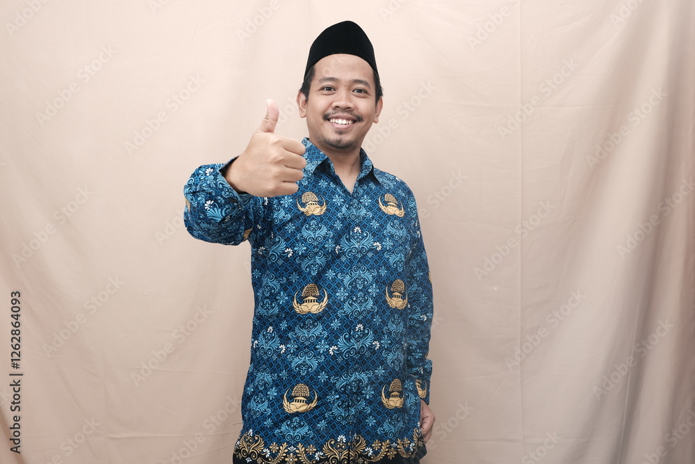 Handsome Indonesian government worker man wearing batik korpri uniform ...