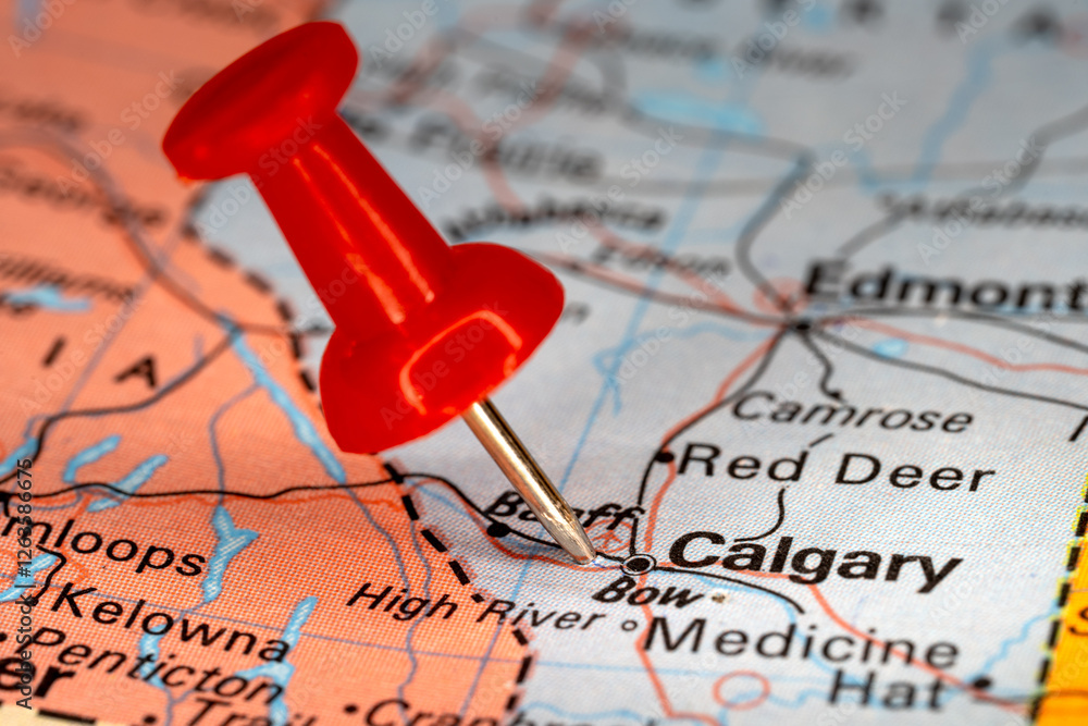 Tourist map of Alberta with a red pin stuck in next to Calgary ...