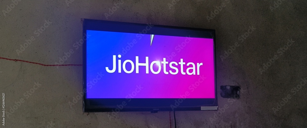 New Delhi, India - February 15 2025. Jio hotstar app icon on LCD tv ...