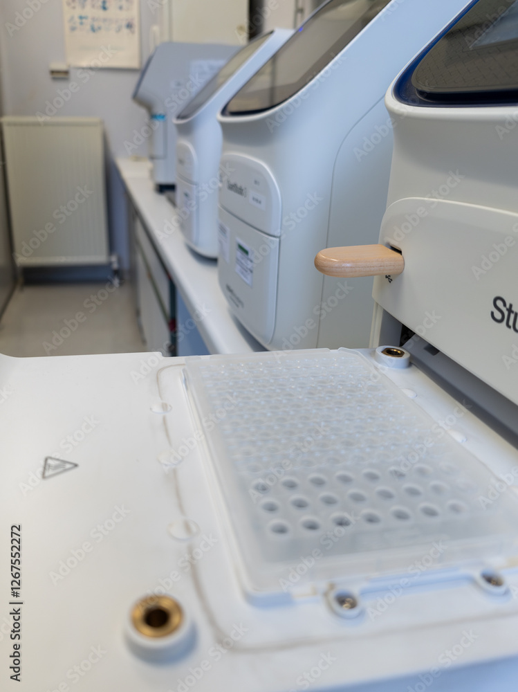 Sideview of a real time pcr instrument in an analytical laboratory. The ...