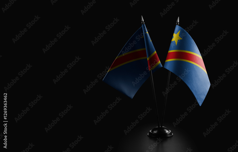 Small national flags of the Democratic Republic of the Congo on a black ...