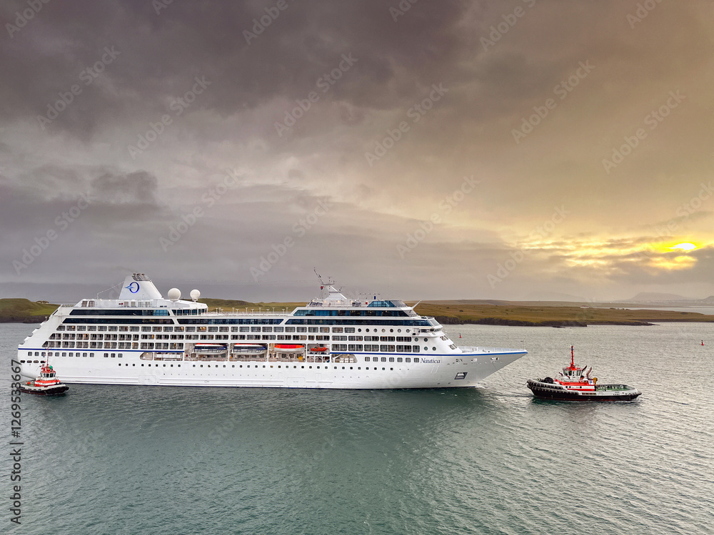 Reykjavík, Iceland - 22 August 2024: Cruise ship Nautica being assisted ...