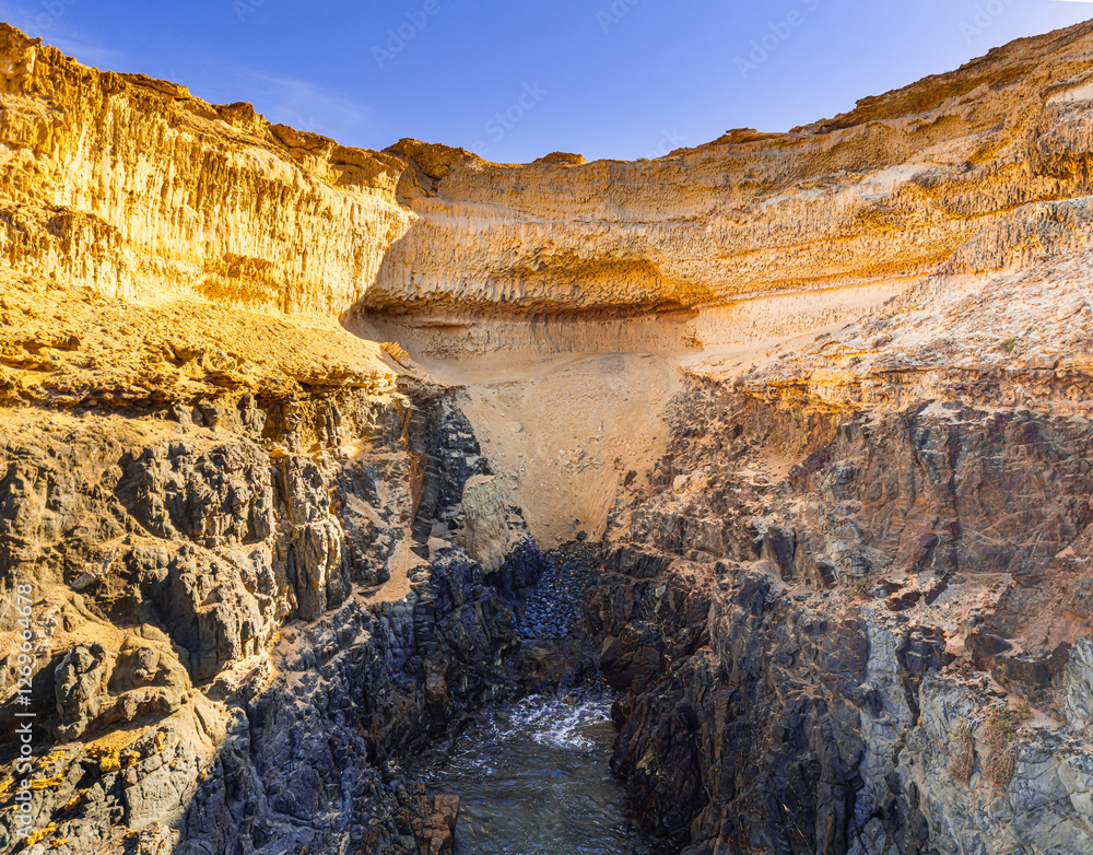 Aerial image of the coastal cave formed from wind erosion with aero ...