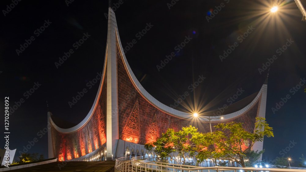 evening photo of the masjid raya sumatra barat, Indonesia, illuminated ...
