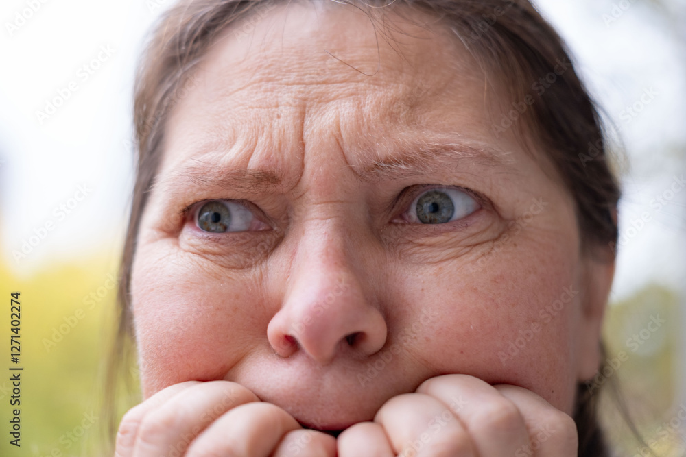middle-aged mature woman with bulging eyes, face close-up, goggle eyes ...