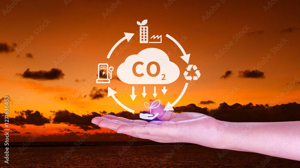 Hand holding CO2 reducing virtual icon for decrease carbon dioxide emission, carbon footprint ...