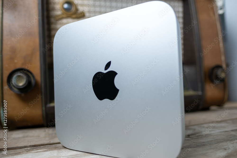 Mac Mini M1 Apple computer held, retro radio, old and new technology ...