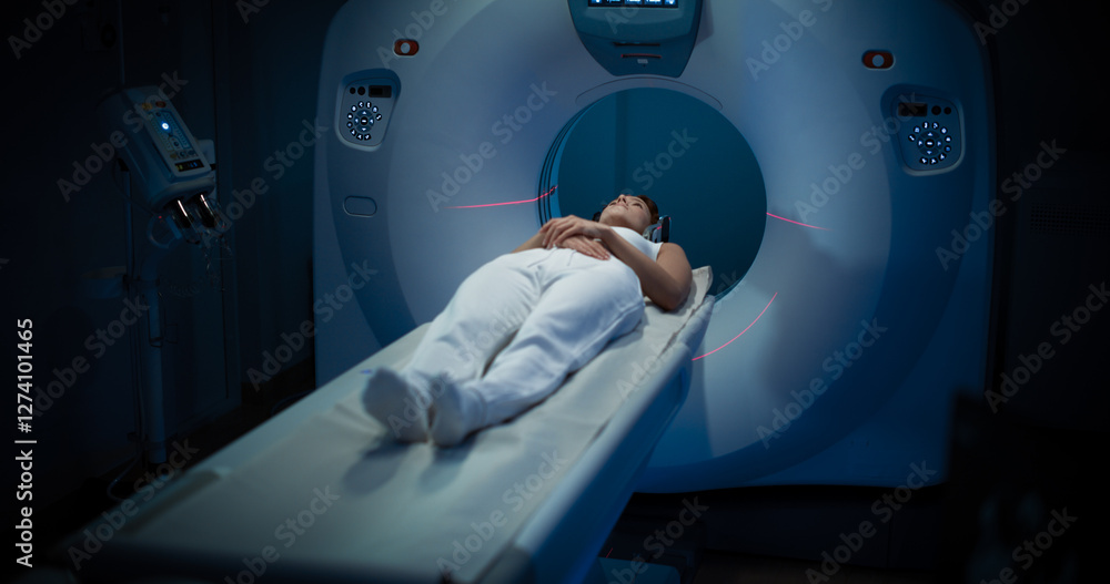 Medium Shot of a Female Patient Lying on a CT or MRI Scan, Bed is ...