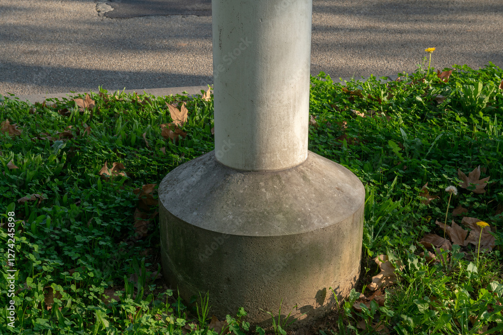 Photo Stock steel pillar, circular plinth with reinforced concrete at ...
