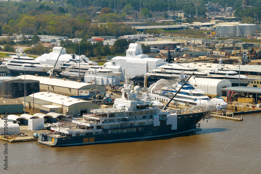 Production shipyard with deep sea luxury yachts under construction ...