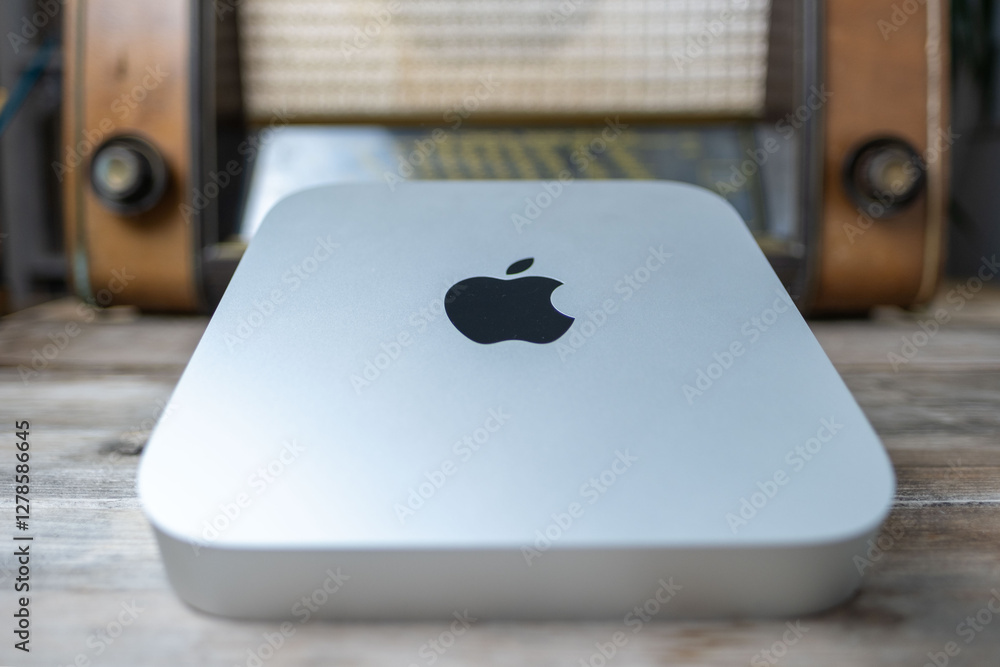 Mac Mini M1 Apple computer held, retro radio, old and new technology ...