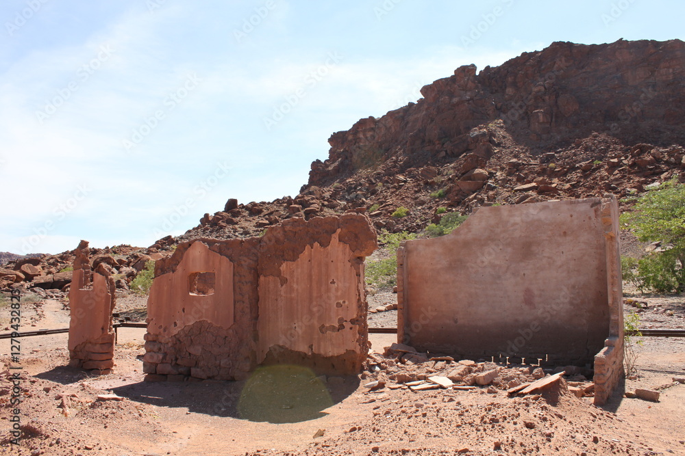 Farmhouse ruins and remains of surrounding compound of abandoned farm ...