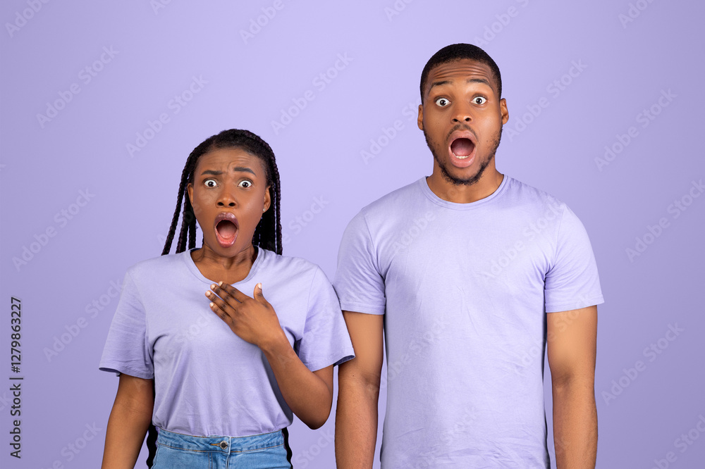 Shocked African American couple opening mouths in shock, putting hand ...