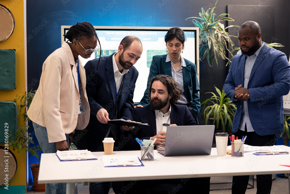 CEO verifies what his employees achieved with the new project, reading ...