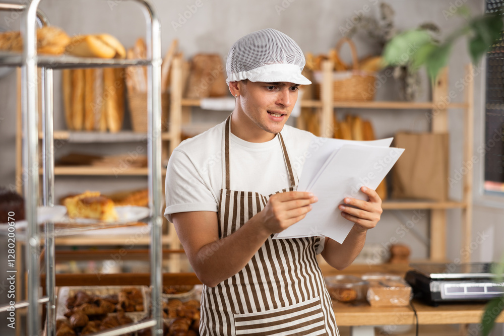 During working day, guy owner of bakery received documents and activity ...