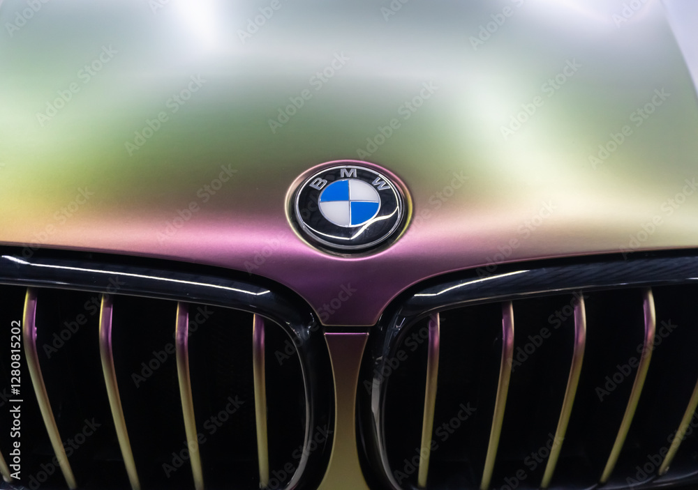 Stock-Foto „BMW logo on the hood of the car is chameleon colors. Close ...