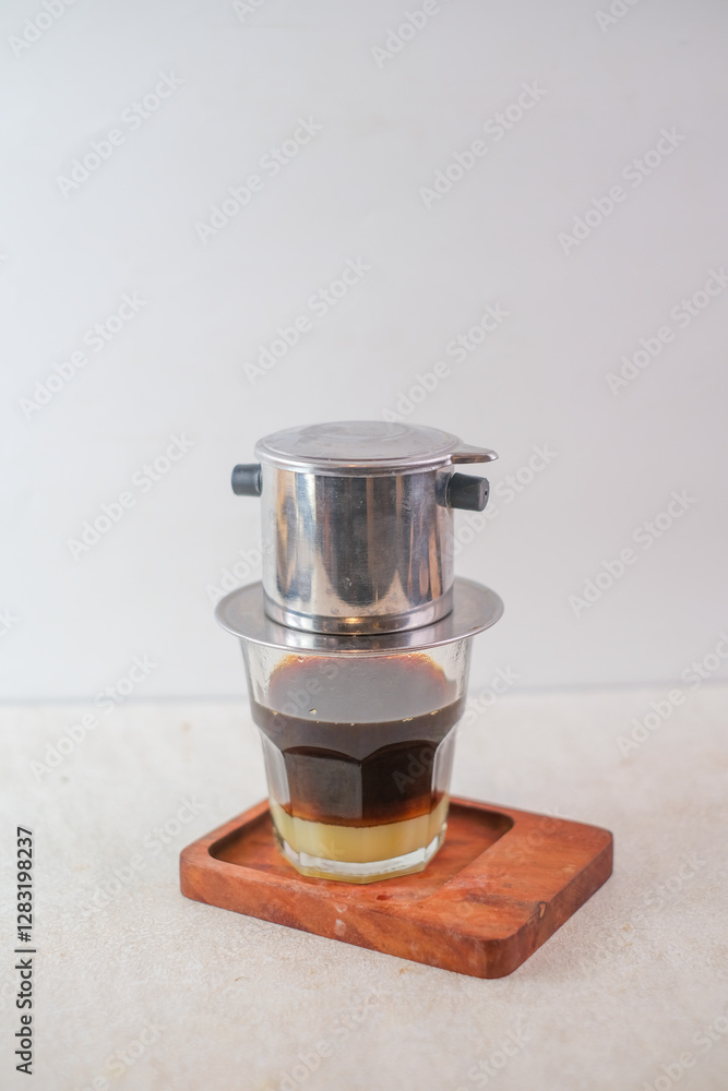 Vietnamese Drip Coffee Maker On Clear Glass With Condensed Milk Layer ...