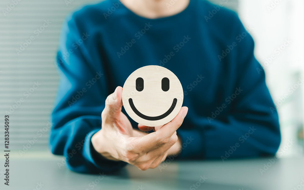Positive mindset and mental health concept. Man holding wooden smile ...