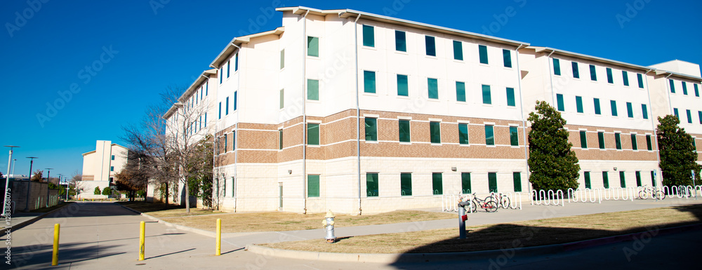 Panorama view college campus buildings entrance with safety bollards ...