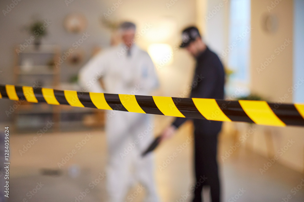 Crime scene at home secured with yellow-black police tape while a ...
