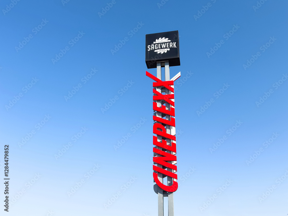 Cineplex sign against a clear blue sky showcasing modern cinema ...