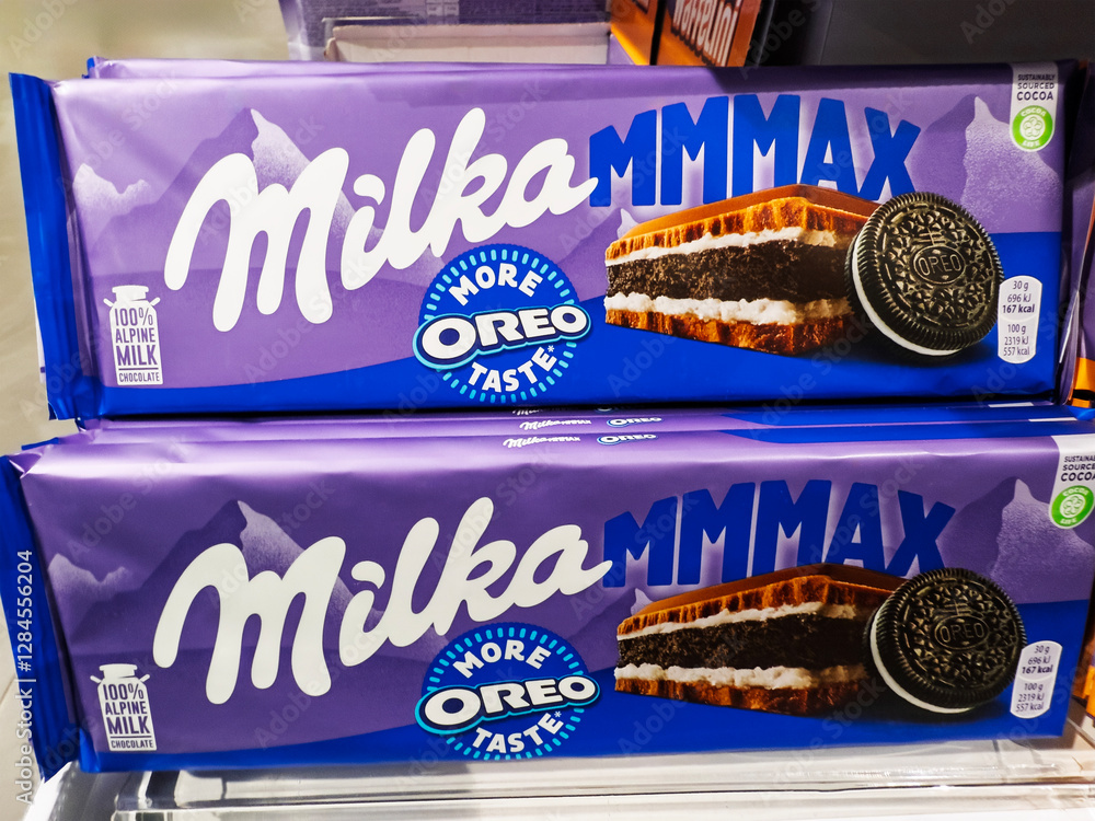 Snack bars milka are displayed prominently on a shelf, showcasing ...