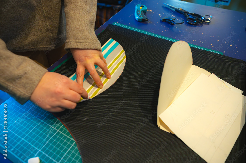 Handmade tailoring workshop, the process of marking and cutting fabric ...