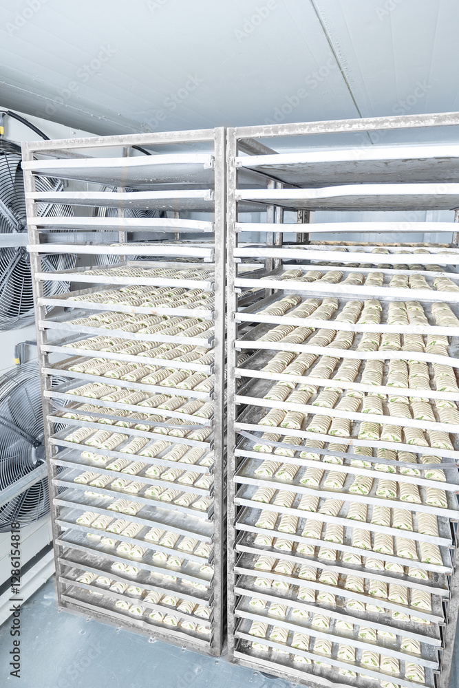 Foto de Stock Shock freezing puff pastry buns in industrial freezer for ...