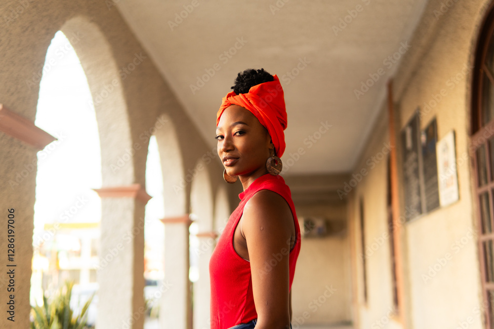 Garifuna woman wearing traditional orange turban in caribbean corridor ...