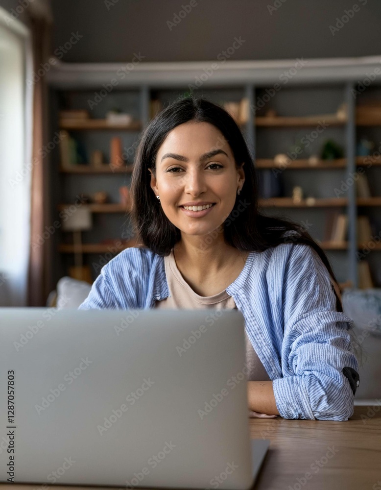 Headshot of a smiling young woman making a video call, using a webcam ...
