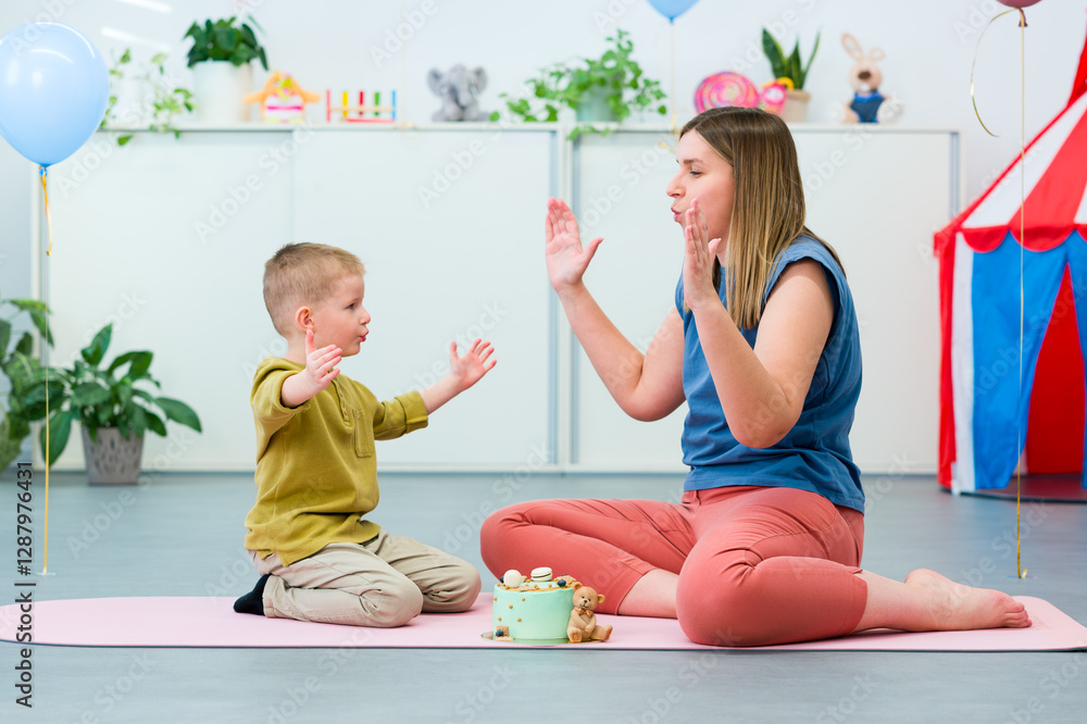 Baby Sign Language. Nonverbal child learning to sign with the help of a ...