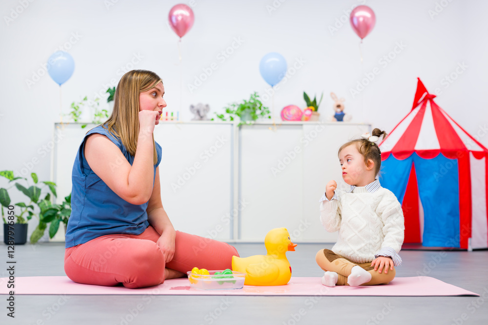 Nonverbal child with Down syndrome learning baby sign language with the ...