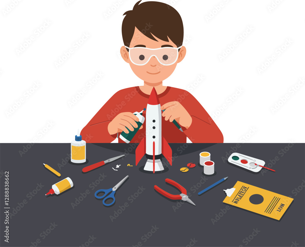 Young boy assembling a model rocket with various crafting tools on a ...
