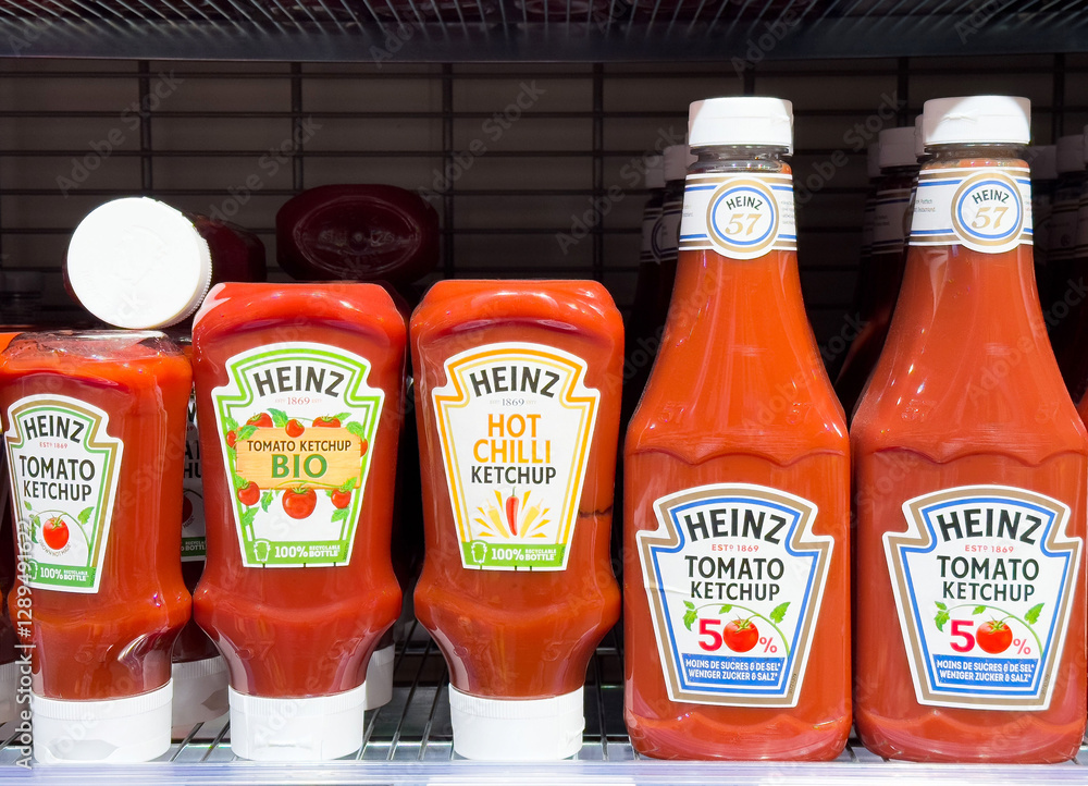 Variety of Heinz ketchup bottles displayed on a supermarket shelf ...