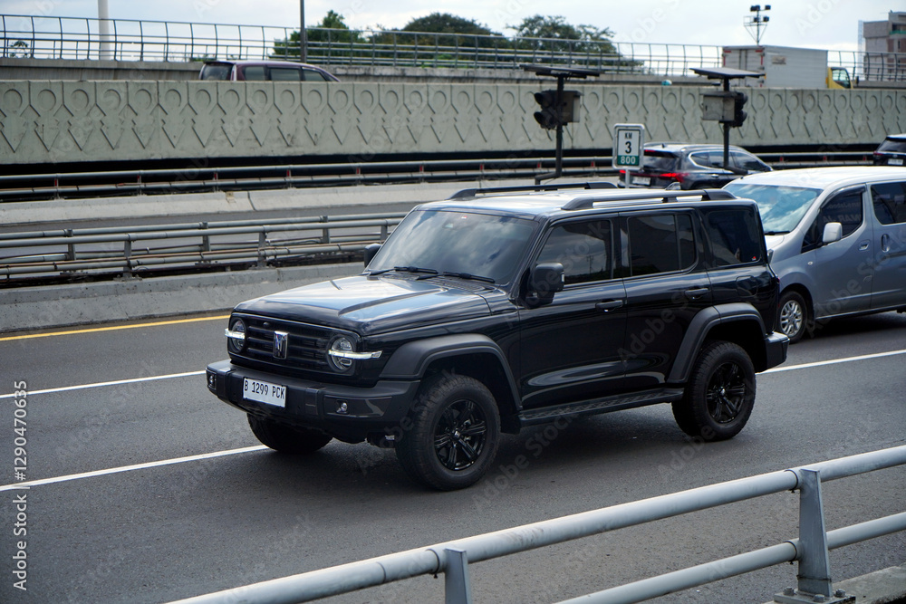 Luxury big SUV GWS Tank 300, Electic car black color on the highway in ...