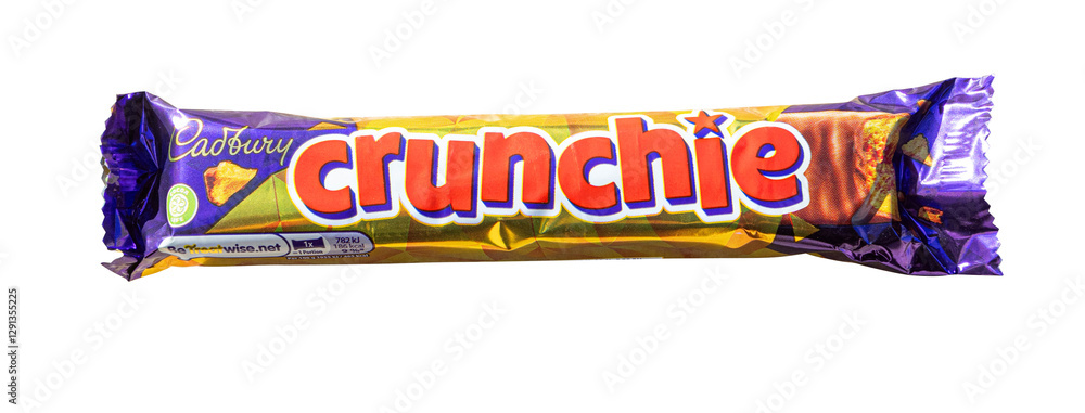 Crunchie chocolate bar manufactured by Cadbury, pictured over a plain ...
